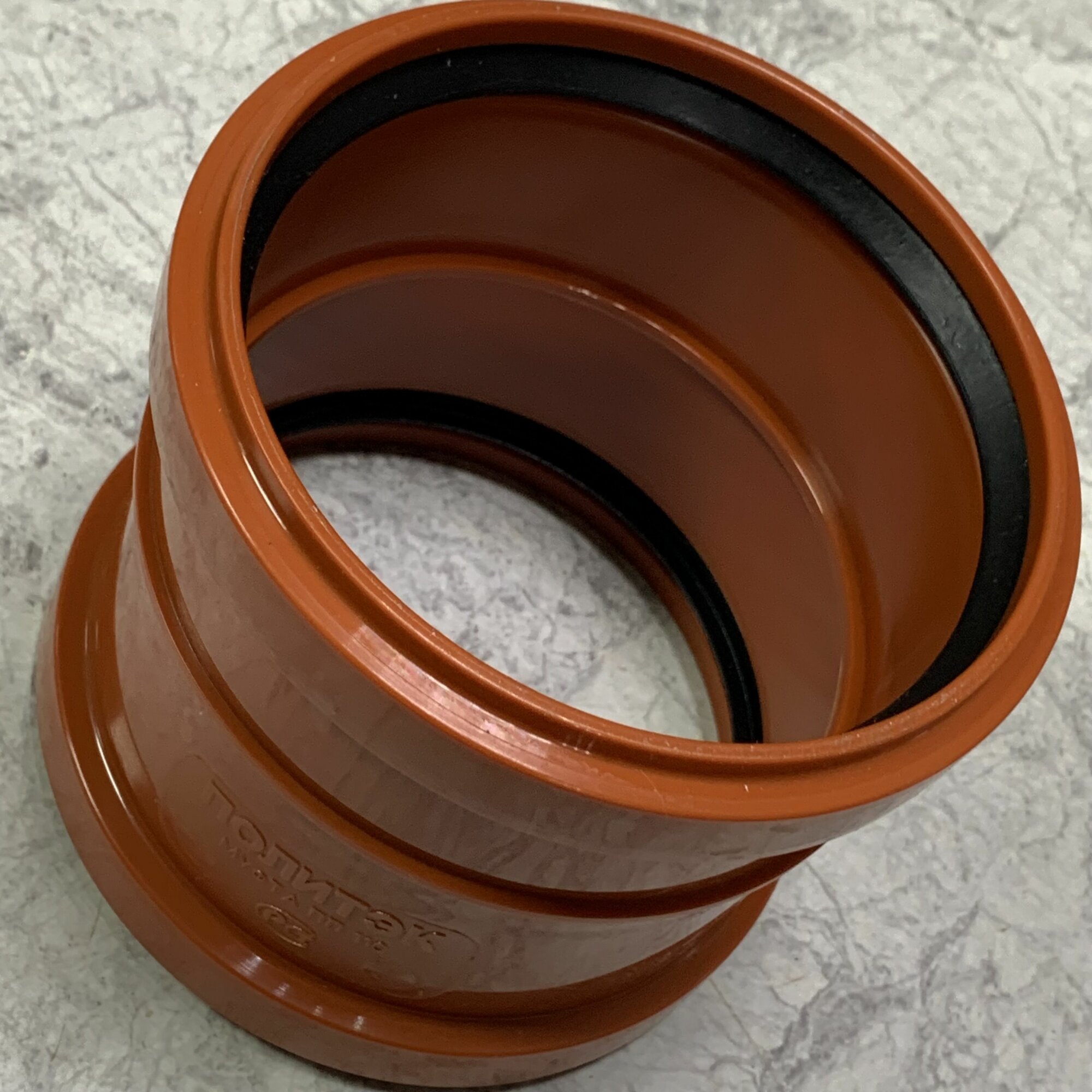 Муфта двухраструбная 110 рыжая Политэк (с ограничителем внутри)