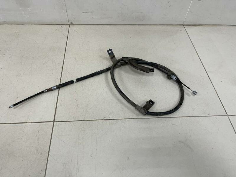 Трос стояночного тормоза левый Kia Rio X-Line 2017 кат.номер: 59770H9000