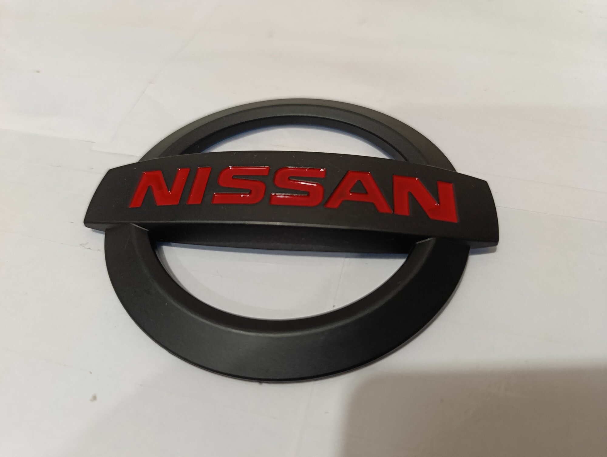 Эмблема Nissan 88х76мм черная Black