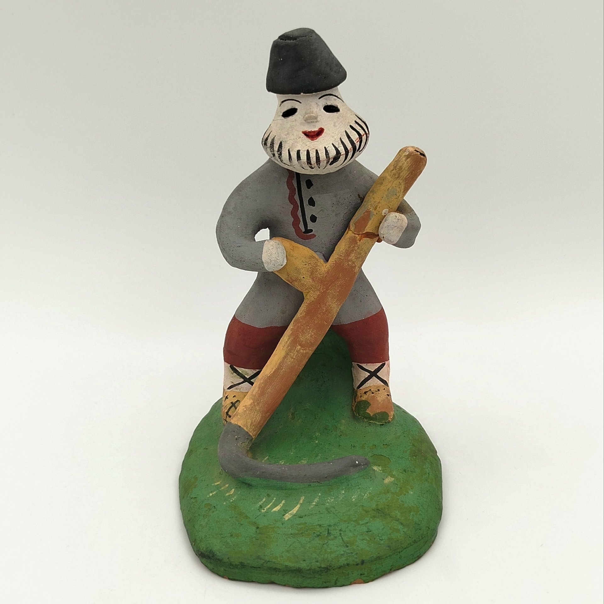 Игрушка каргопольская "Мужик с косой", глина, роспись, СССР, 1970-1980 гг.
