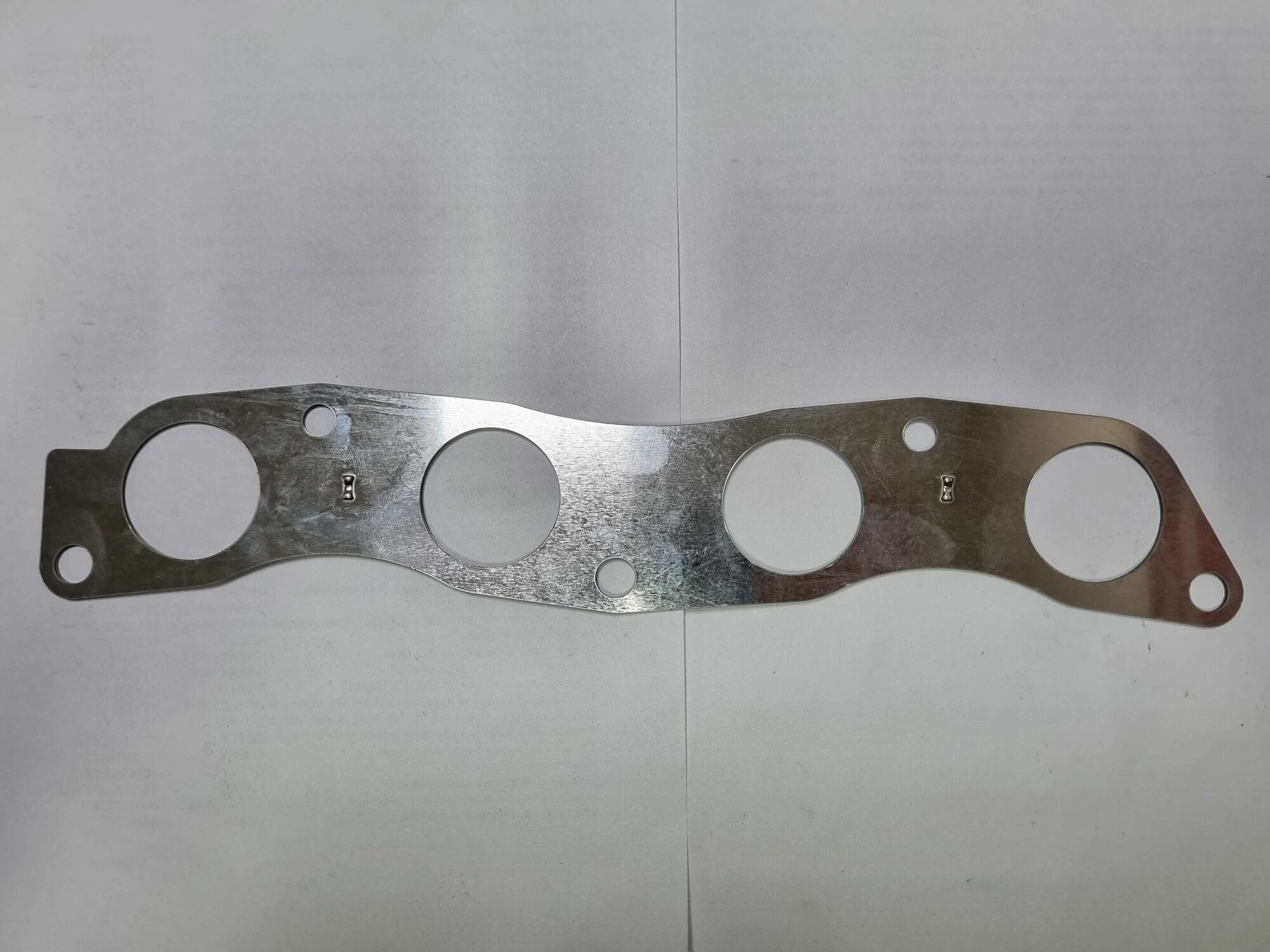 Прокладка выпускного коллектора MANDO Tagaz C10 [1.3 16V 5MT седан]