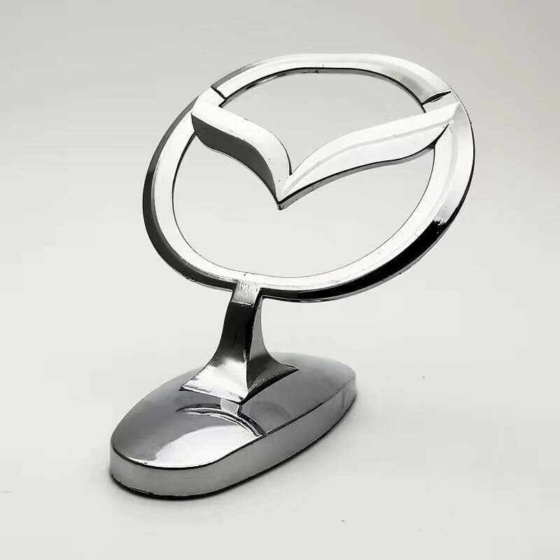 Эмблема на капот Mazda — хромированный знак из цинкового сплава с 3M клеем, оливковое основание, простая установка