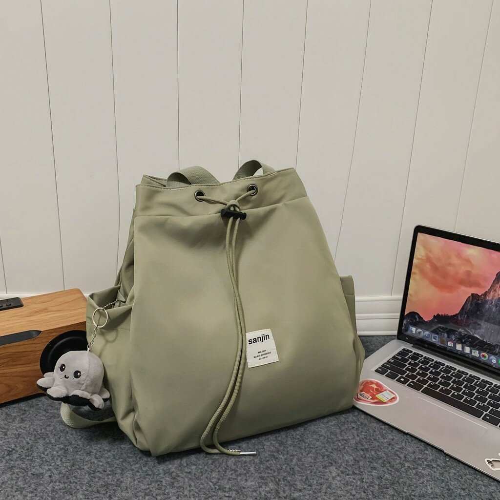 Simple solid color nylon drawstring bag with stitched design for daily commute and leisure activities