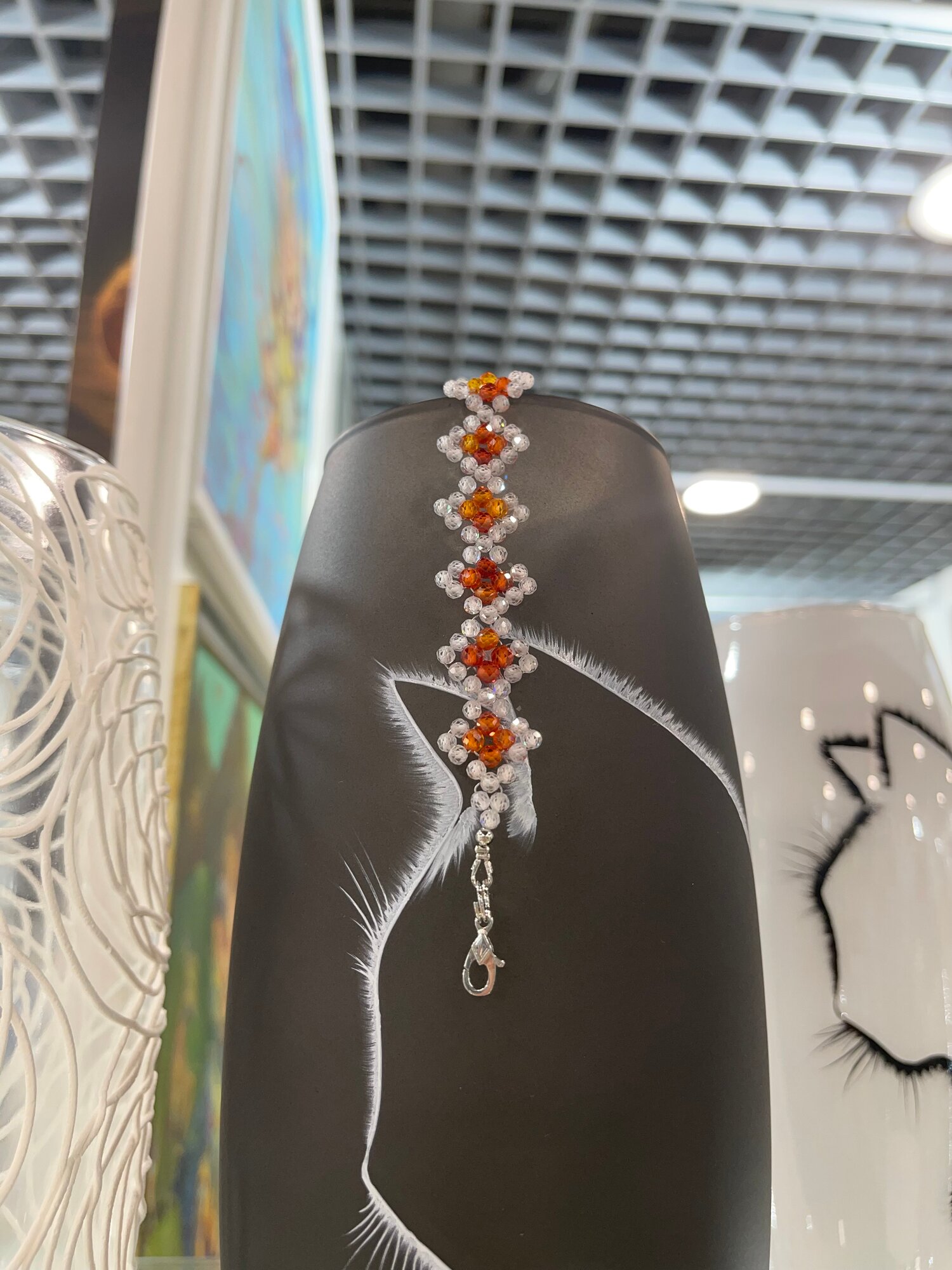 Плетеный браслет Jewellery by Marina Orlova, циркон синтетический, 1 шт., размер 17 см, оранжевый — фото 1