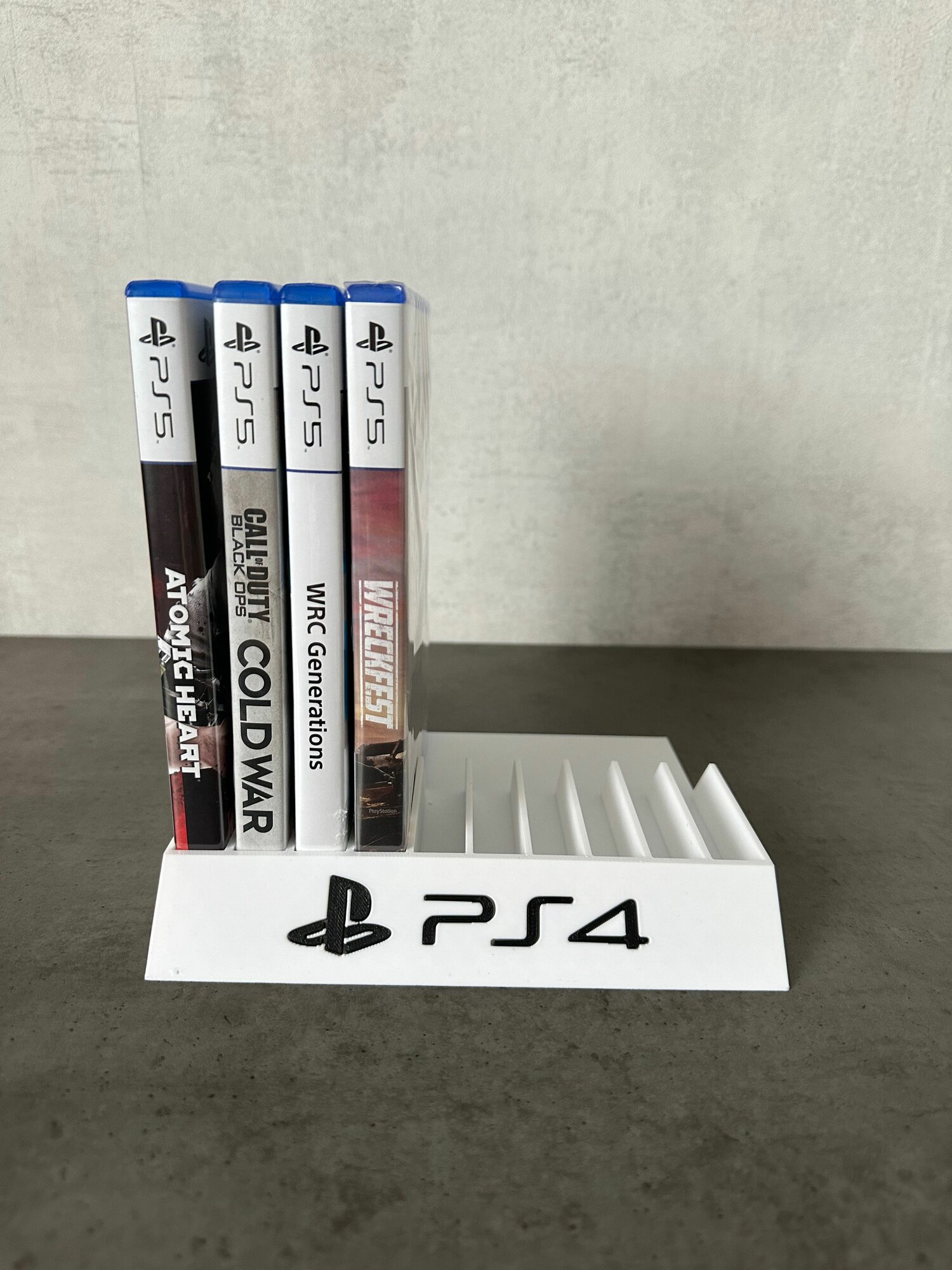 Подставка для дисков PlayStation 4, белая с черным текстом, на 10 дисков без заднего бортика — фото 1
