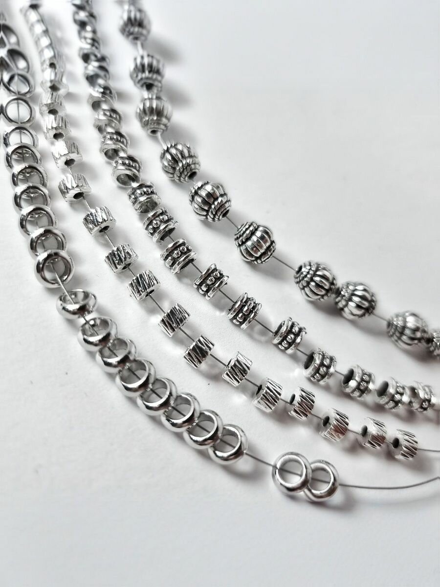 Бусины металлические 5-9мм. 85шт. Цвет стальной.