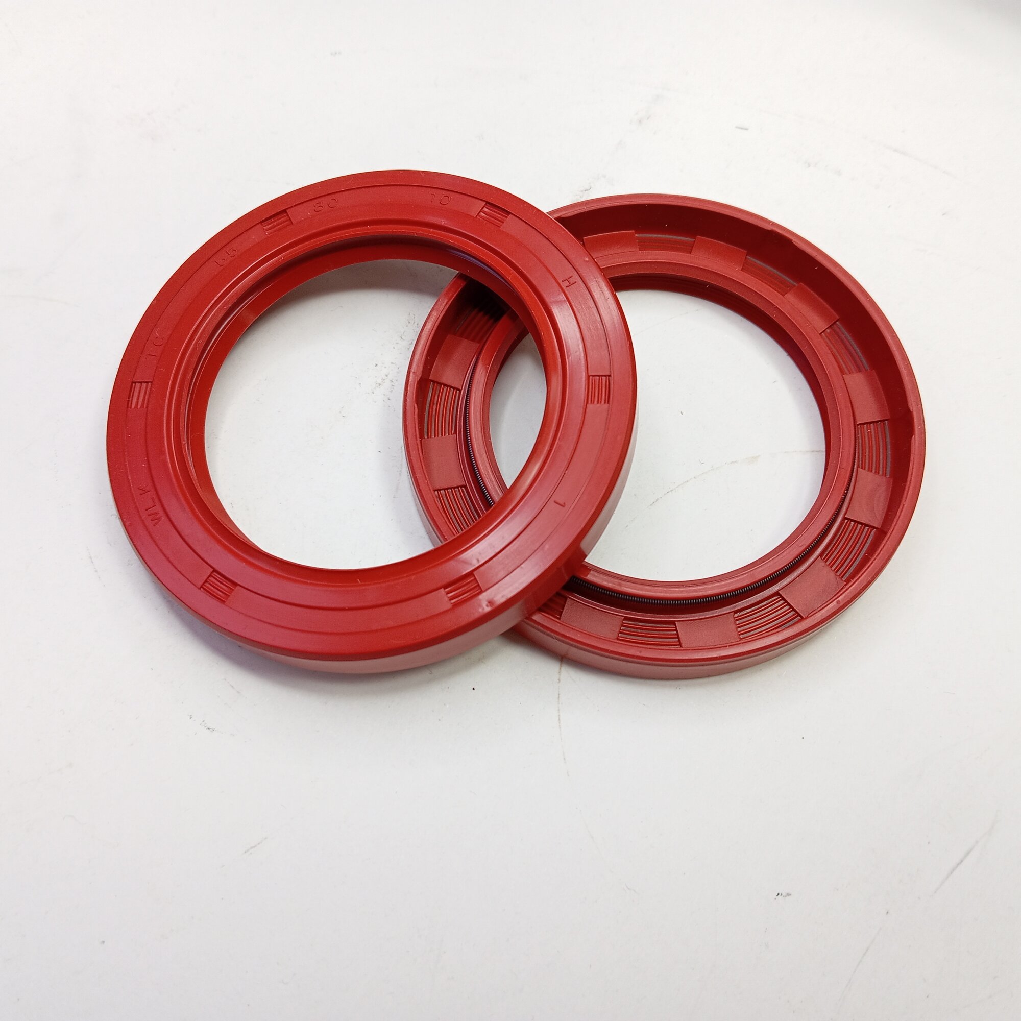 Сальник маслобензостойкий с пыльником силиконовый (манжета армированная) 55x80x10 TC VMQ 70-C-C WLK