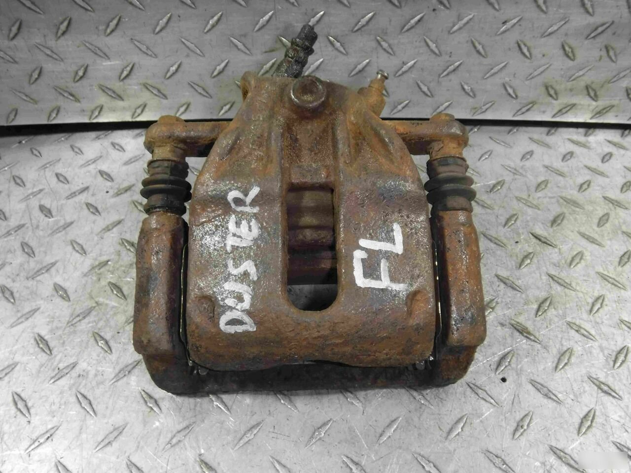 Суппорт тормозной передний левый Renault Duster I (2010—2015) 7701208332