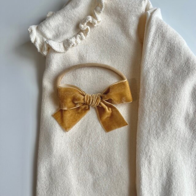 Повязка на голову для девочки бант горчичный