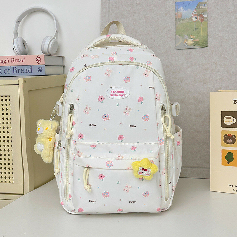 Crossborder style nylon backpack with star badge and pendant for daycare and weekend trips white