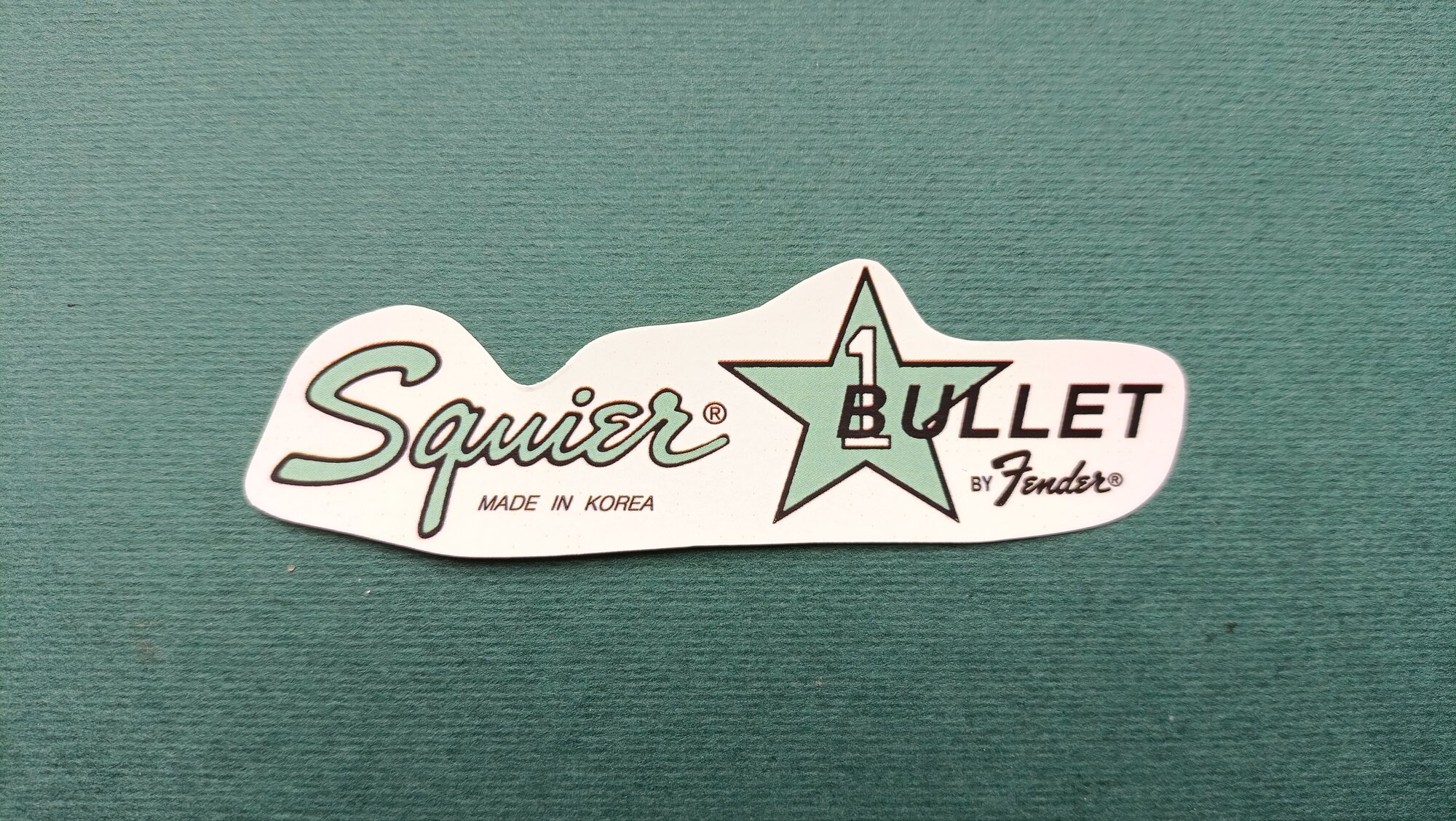 Деколь (водный перевод, waterslide decal) на голову грифа электрогитары Squier Bullet.