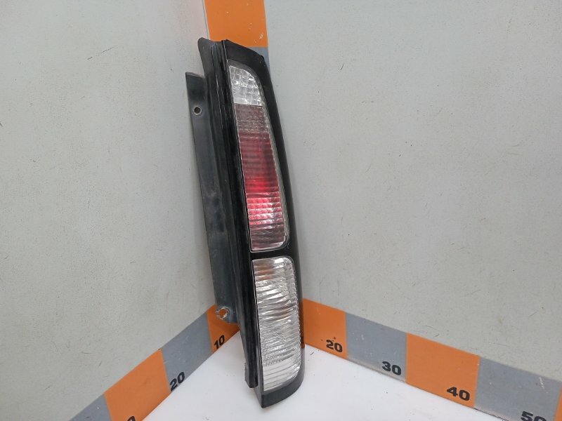 Б/У с дефектом, оригинал, Ниссан Куб Z10 Фонарь задний правый Nissan Cube 2001 ANZ10, AZ10 270448 NISSAN арт. 265502U726