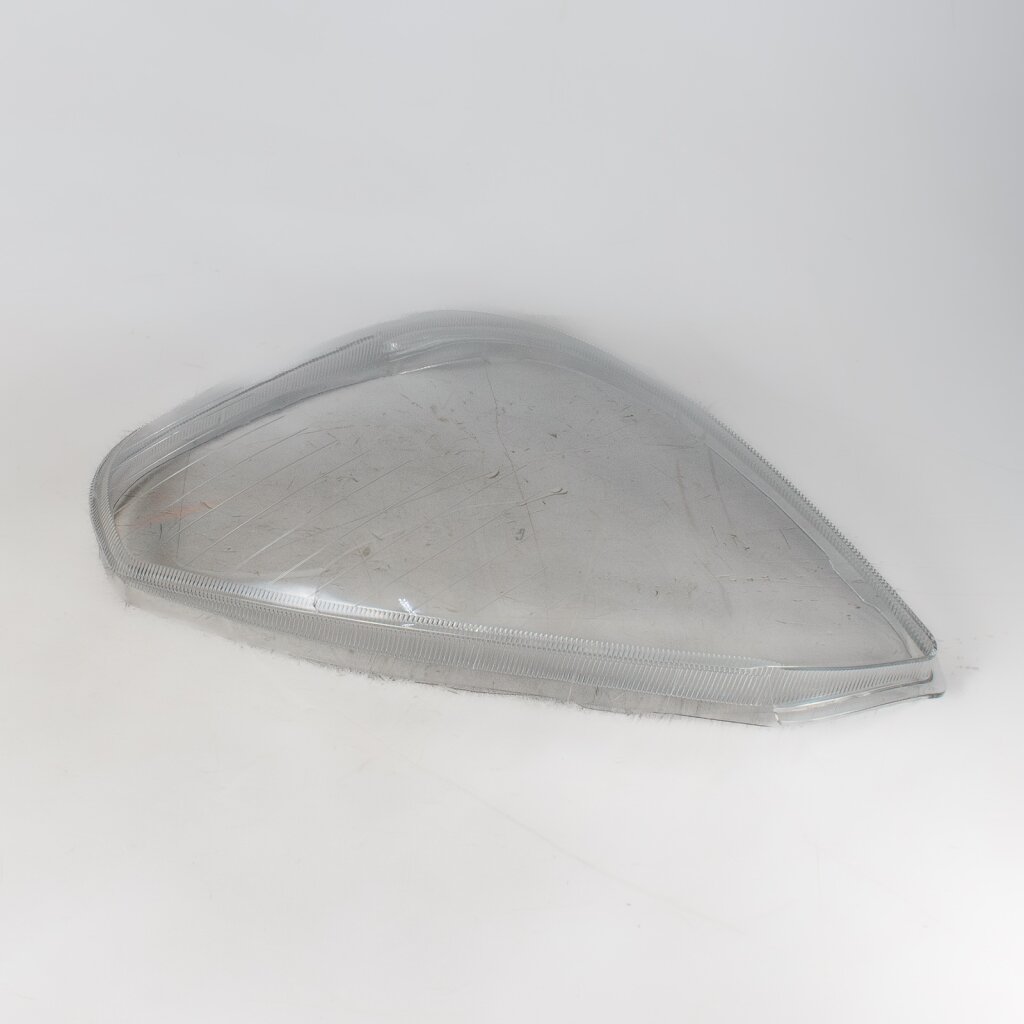 Стекло фары 2170 (левое) "BOSCH" (пластик)