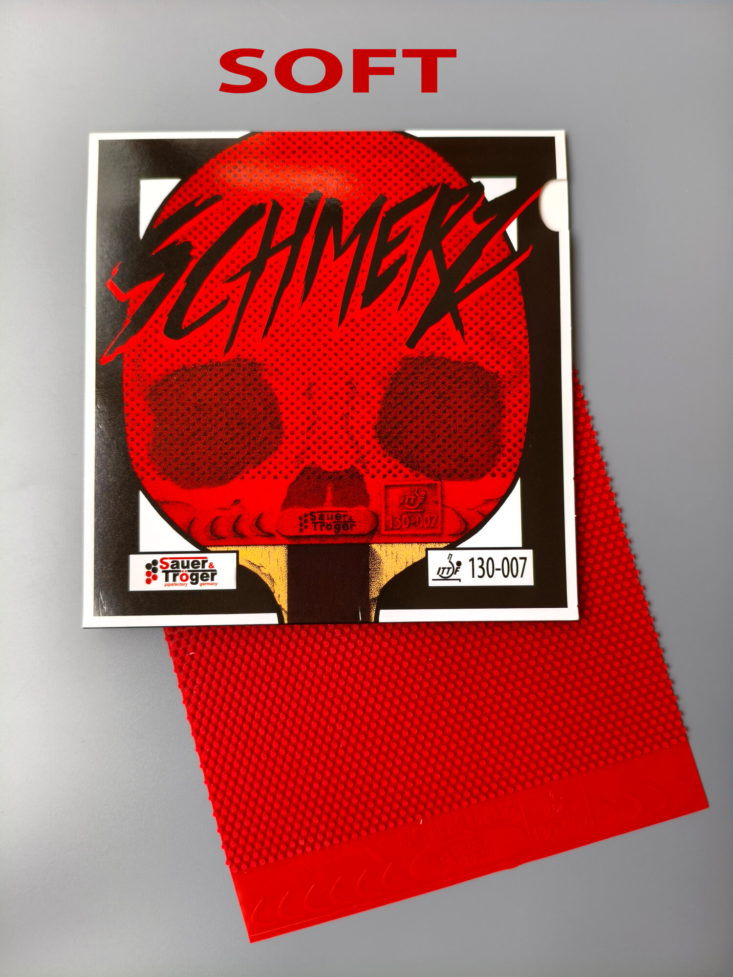 Накладка Sauer&Troger Schmerz длинные шипы OX - Soft / red