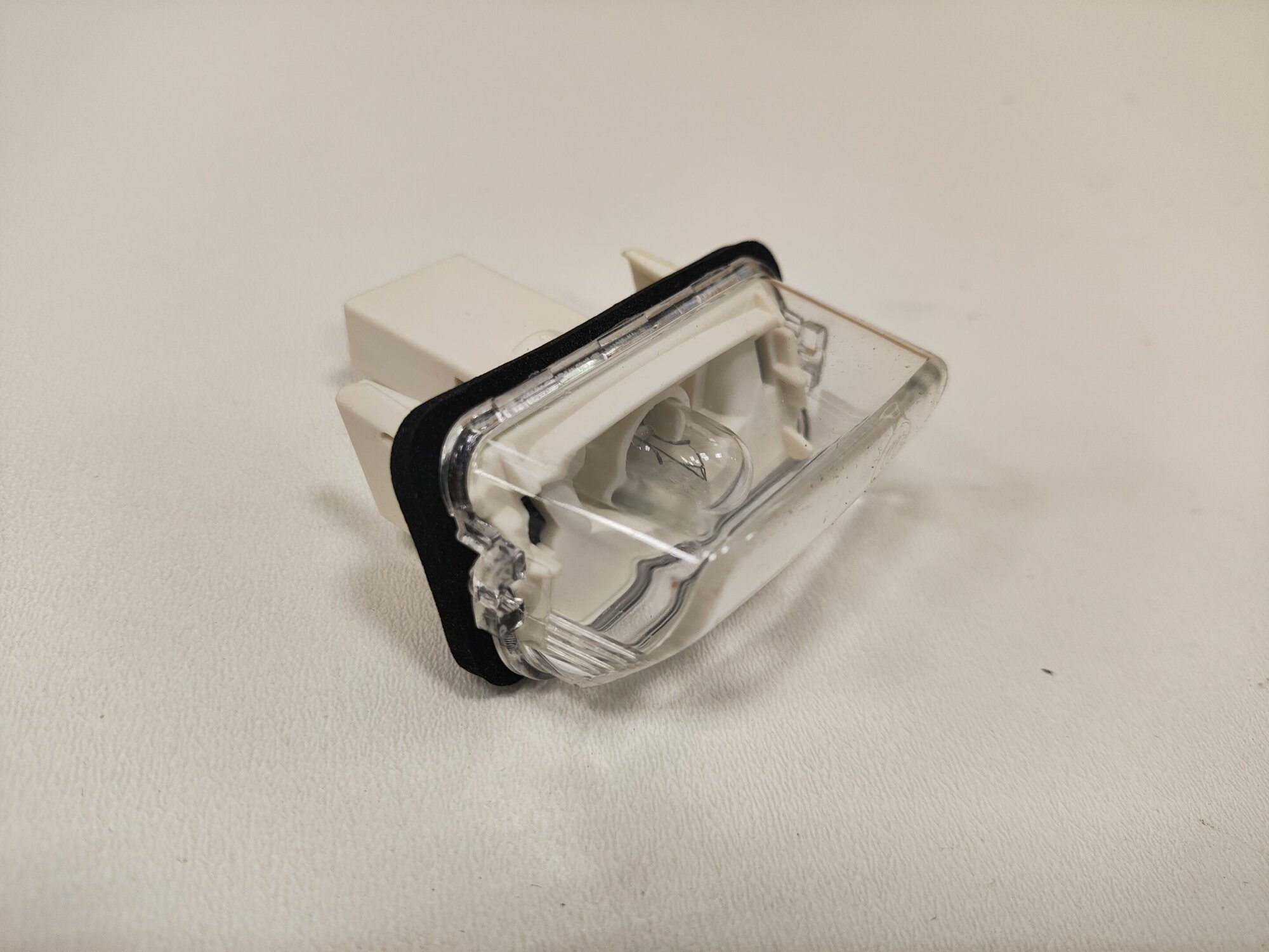 Фонарь номерного знака Dongfeng H30 Cross [1.6 16V 4AT хетчбэк] 7525001