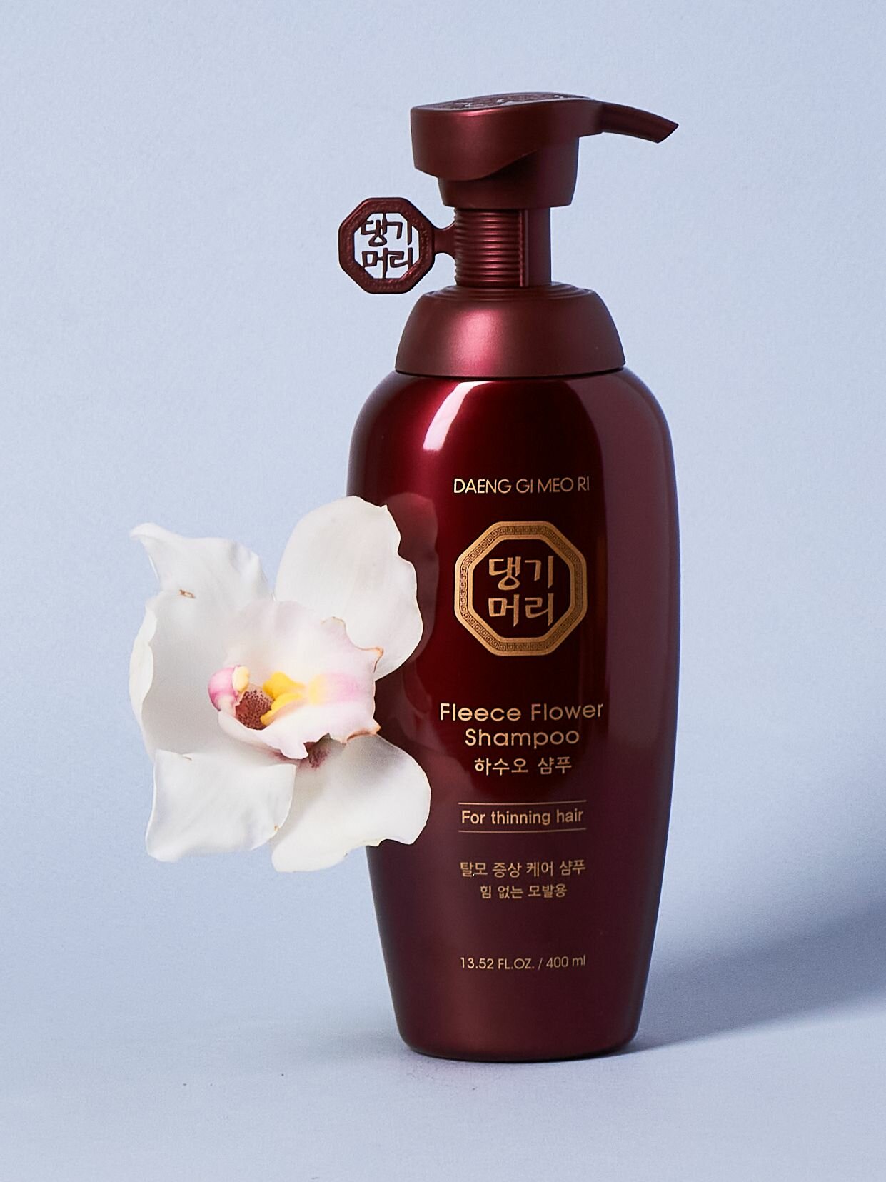 DAENG GI MEO RI Укрепляющий шампунь против выпадения для тонких волос 400мл Hair Loss Care Shampoo For Thinning Hair Fleece Flower