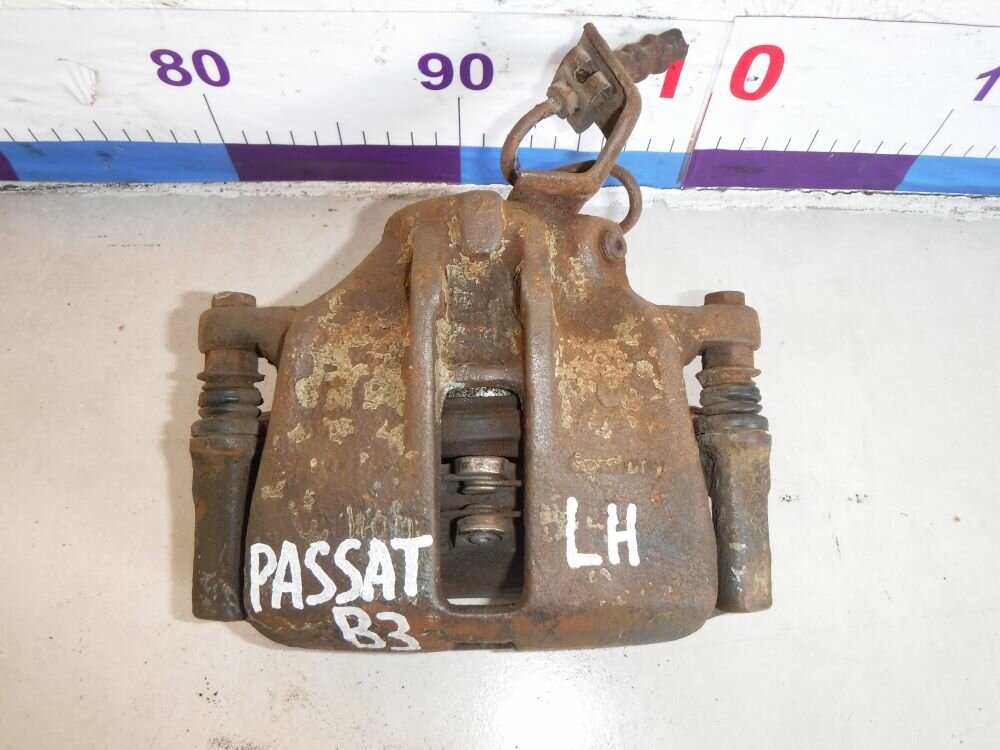 Суппорт передний левый VW Passat B3 357615123AX