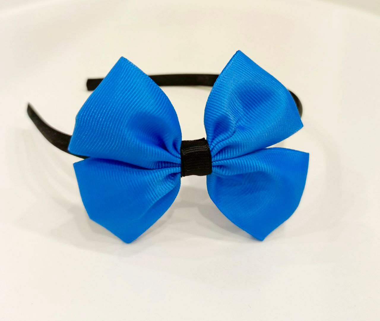 Ободок с темно-голубым бантиком