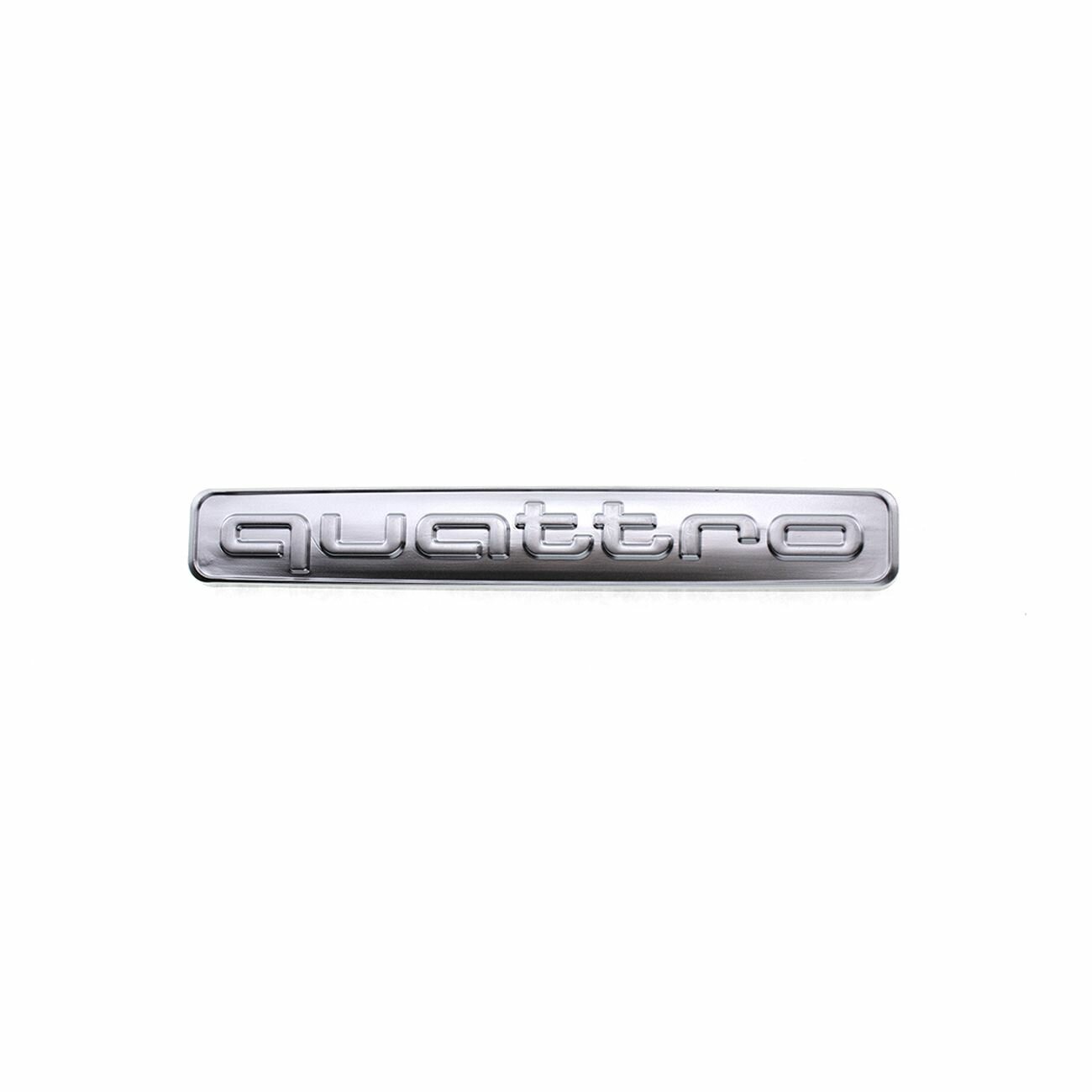 Эмблема на багажник для Audi Quattro серебристая пластик 95х15 мм.