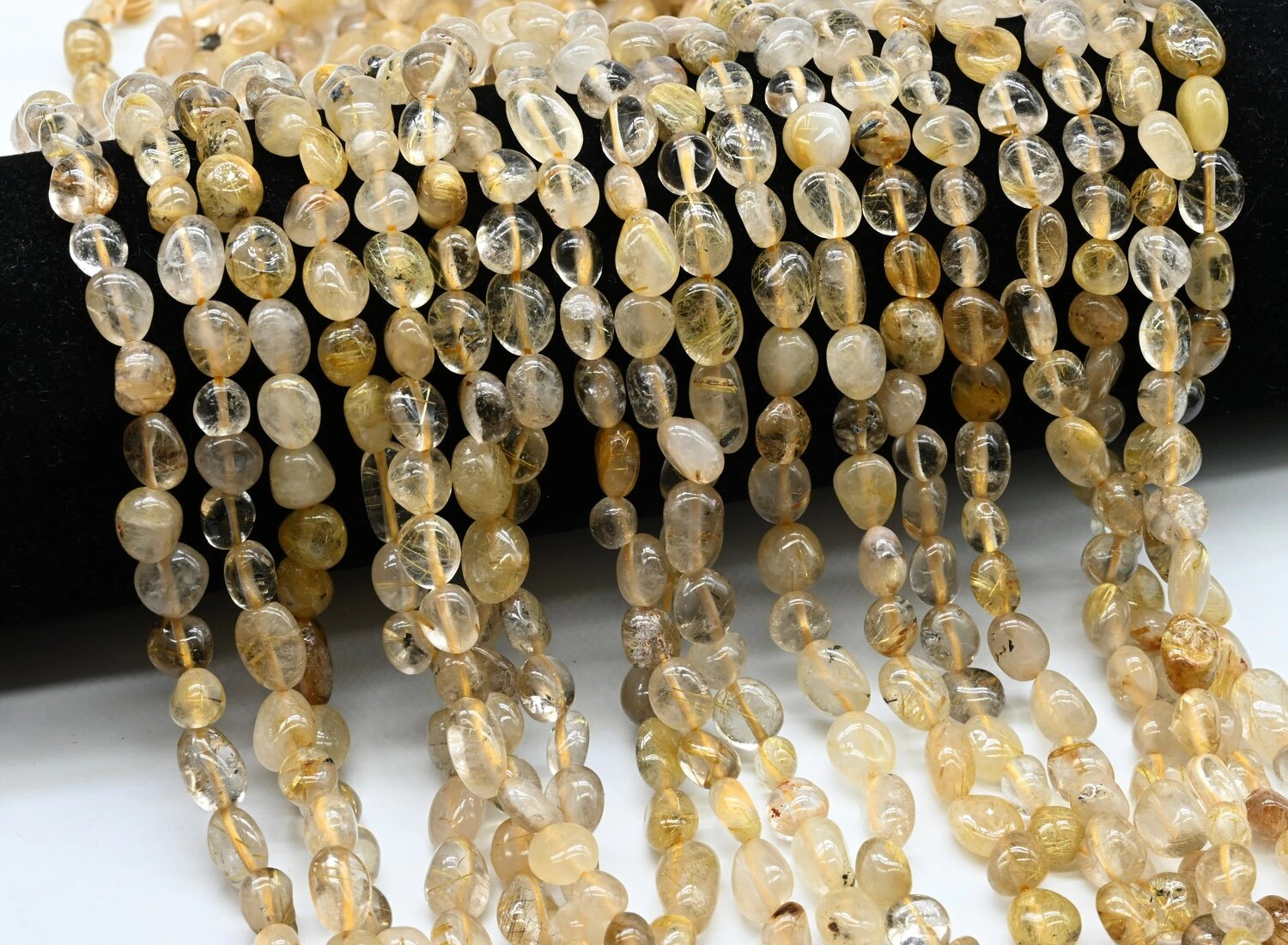 Бусины из рутилового кварца (волосатик золотой) галтовка 7*10мм, 40см, 49 бусин .