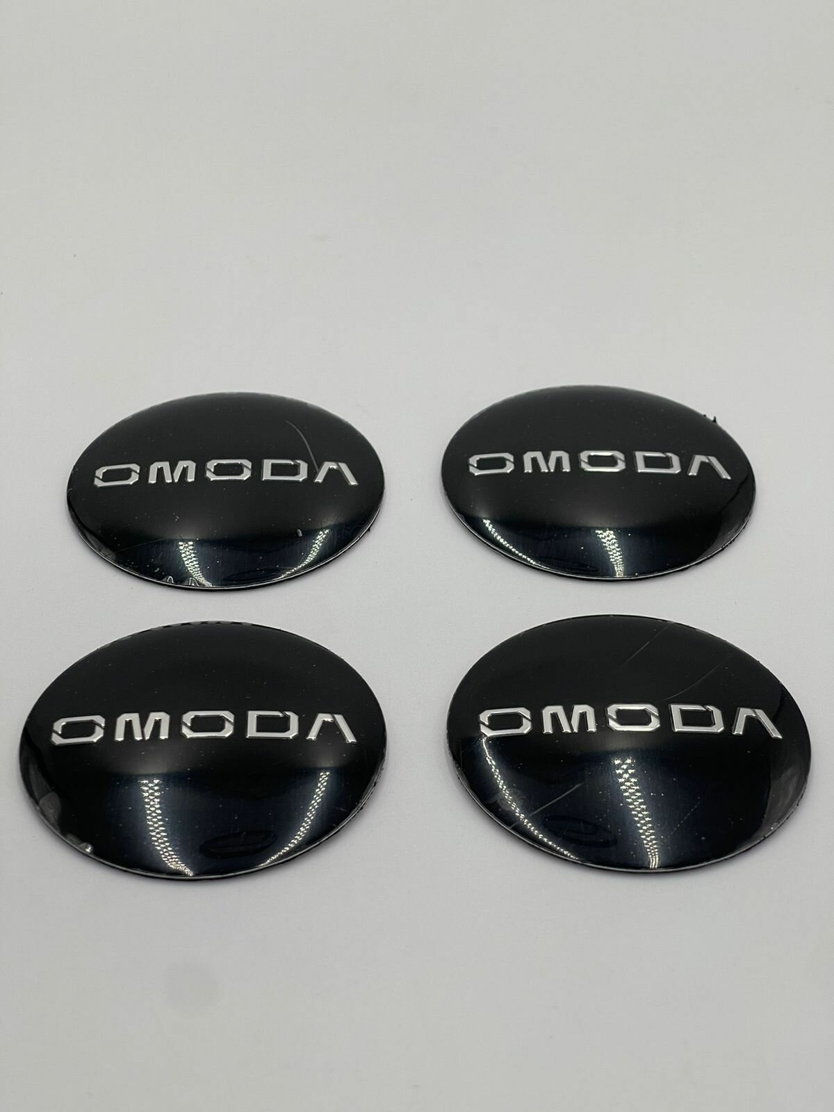 Наклейки на колесные диски Omoda Алюминий 56мм