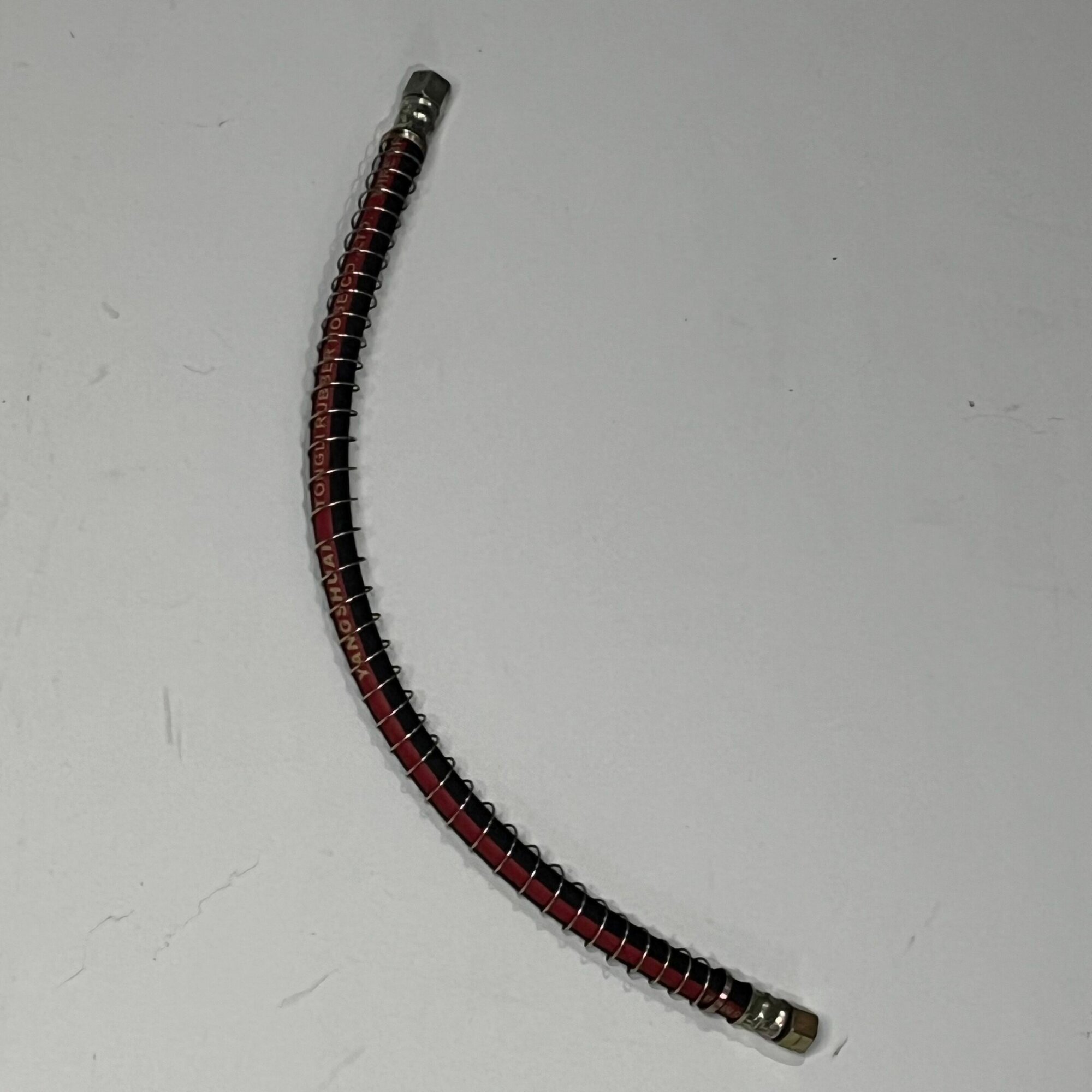 Шланг тормозной в сборе с защитной пружиной (600мм) Sitrak C7H [12.4 24V 12 AMT грузовой 6X2 Turbo дизель (ретардер, Traxon ADR)] WG9112360470