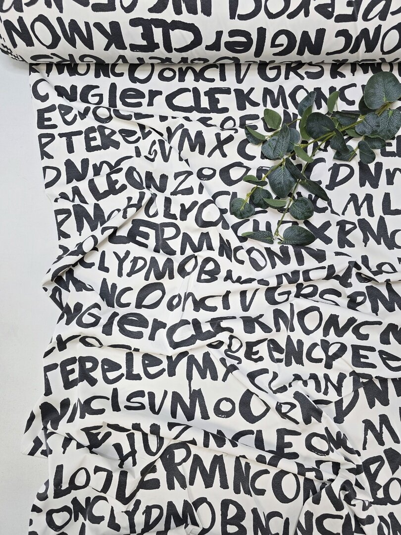 Ткань курточная "Черные буквы на молочном" 100*147 см