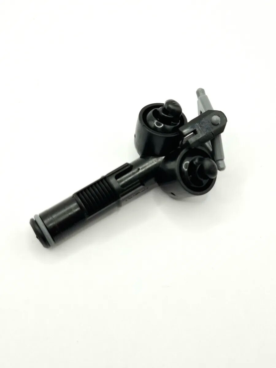 Форсунка омывателя фары правой