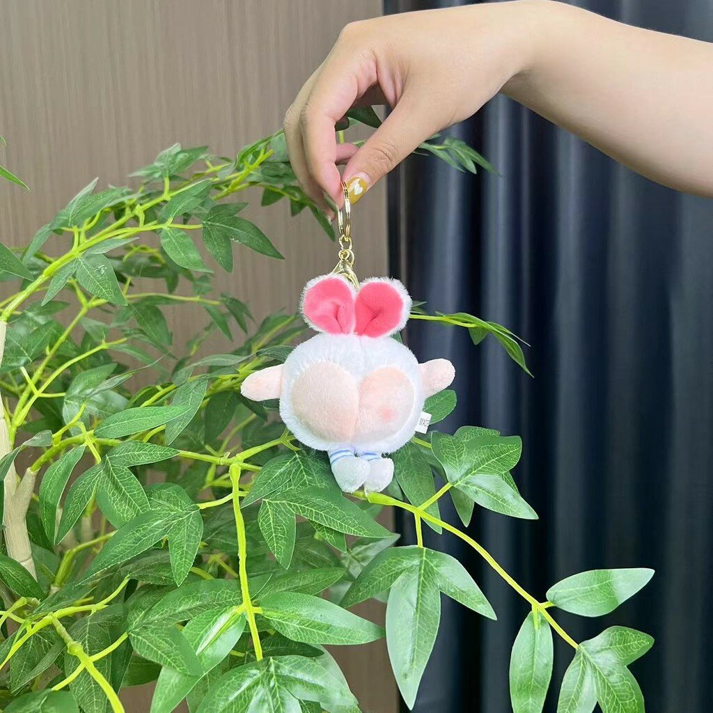 Soft and cuddly peach bunny ear plush doll keychain perfect for bag decoration