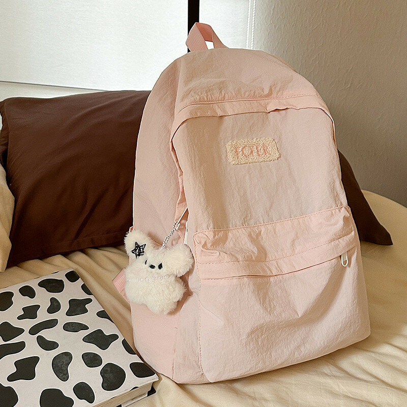 Girls streetwear backpack with padded straps and letter print for school and travel, pink pendant