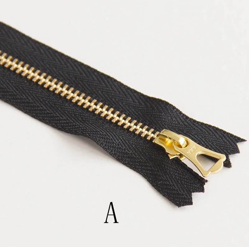 Молния металлическая YKK 3# черная, золотая, 25см
