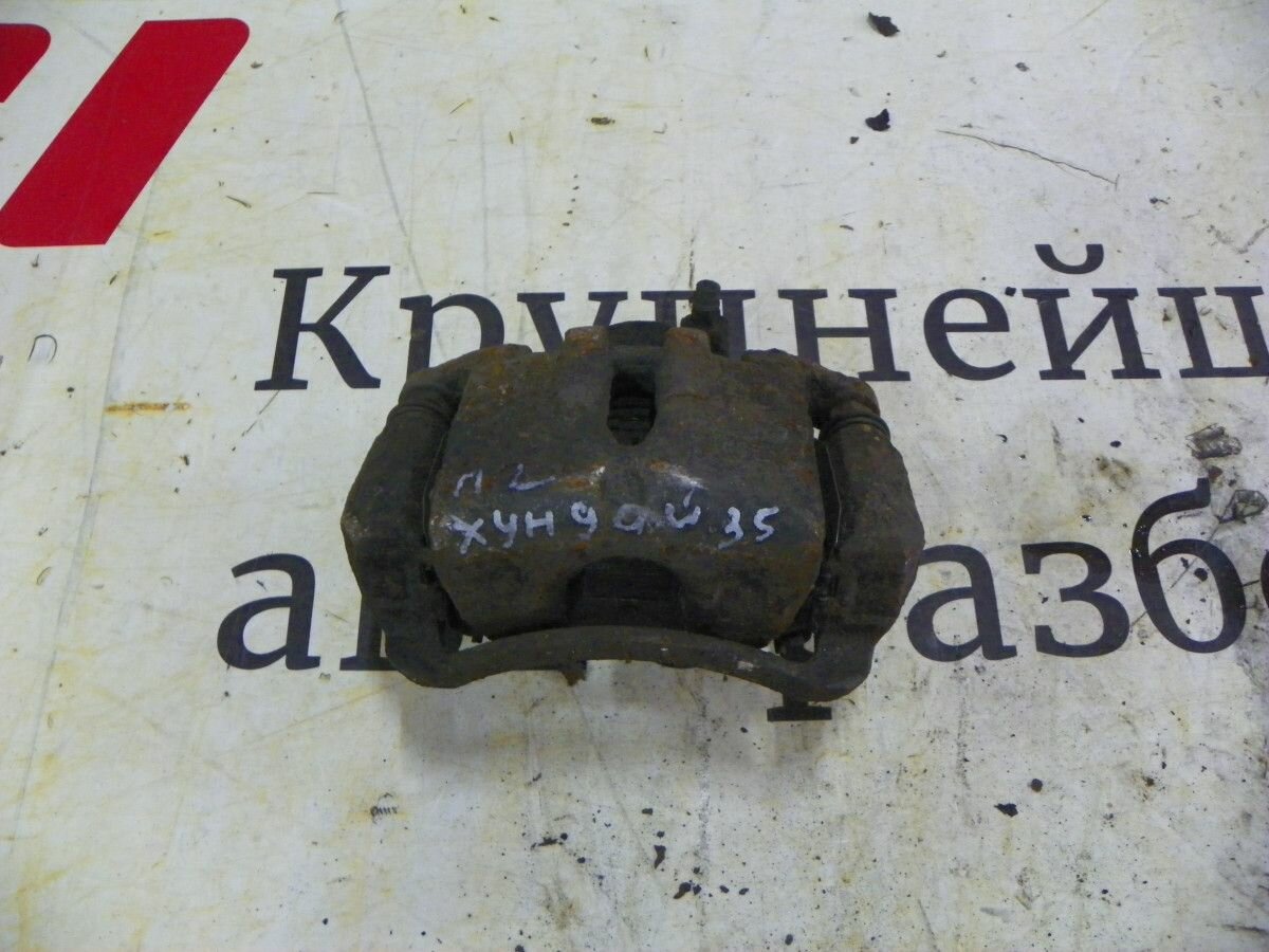 Суппорт тормозной передний левый Hyundai ix35 I (2009—2013) 581102S700