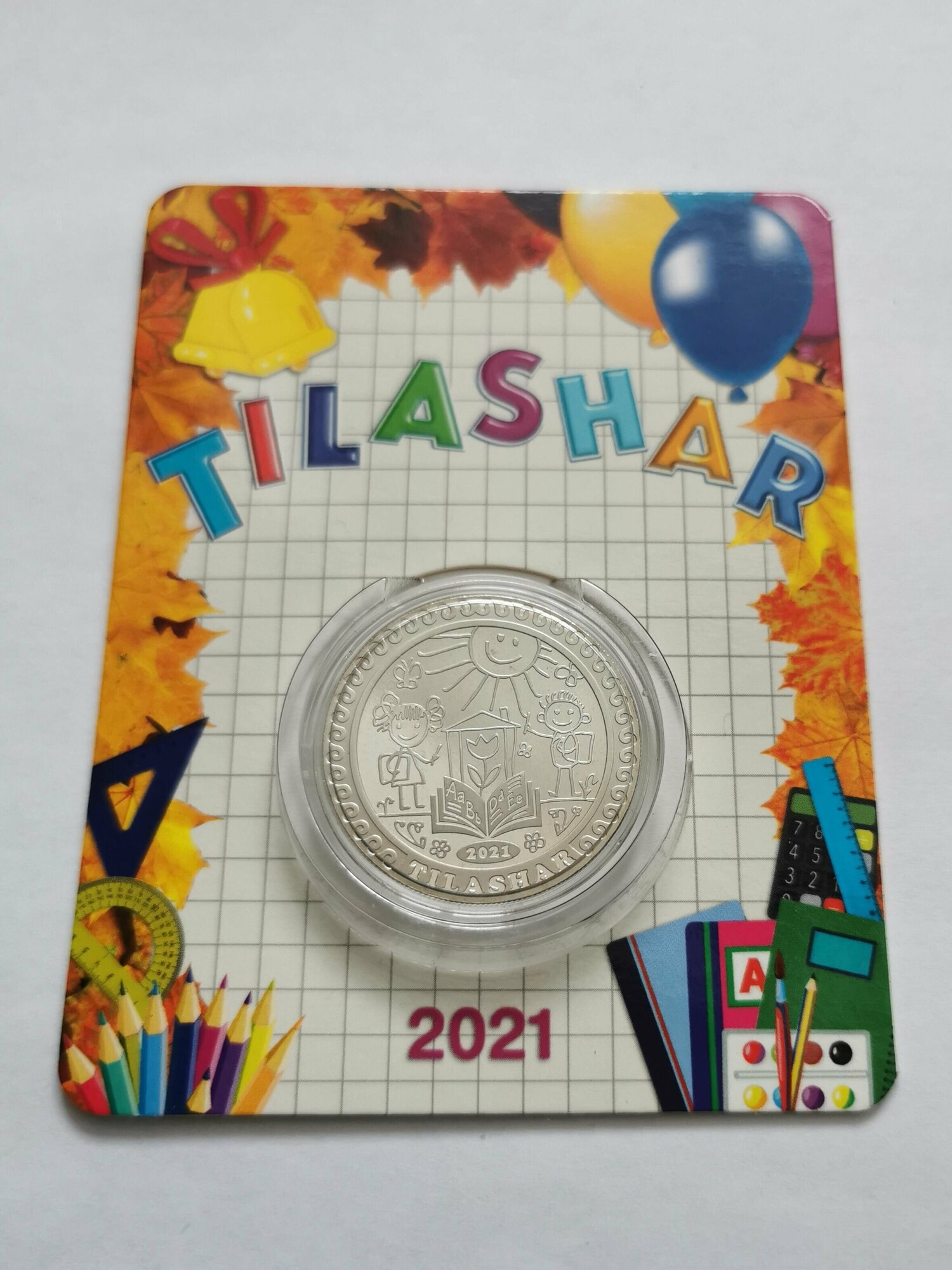 Монета 100 тенге Тилашар в блистере Серия обряды и национальные игры Казахстана