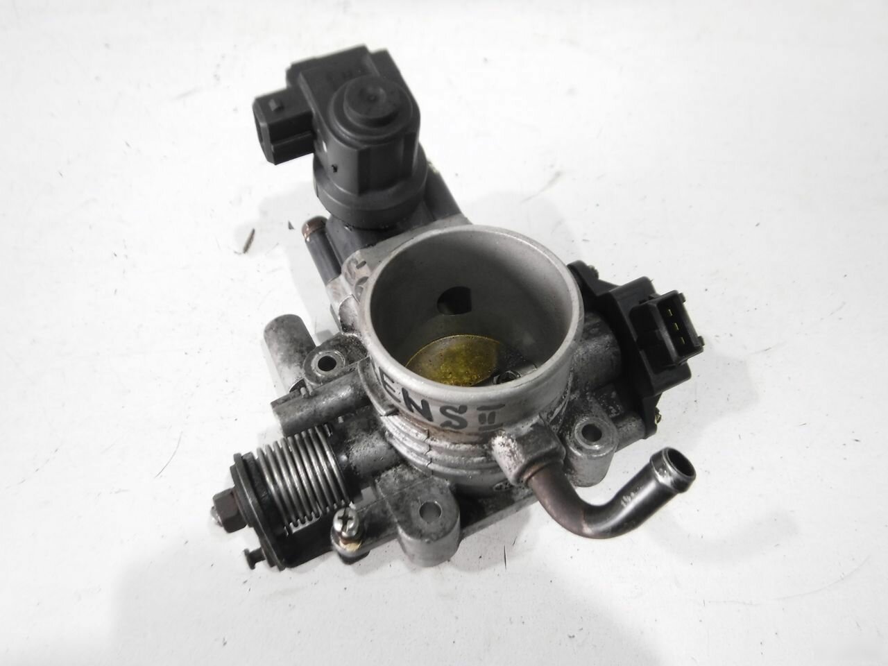 Дроссельная заслонка Kia Carens 0K30E13640