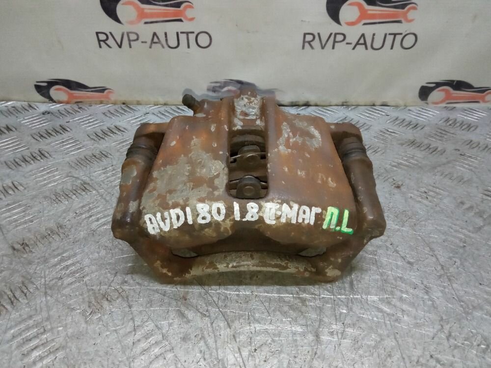 Суппорт передний левый Audi 80 B3 (Ауди) 1986-91 VAG