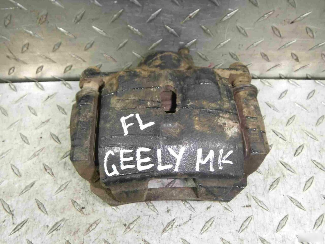 Суппорт тормозной передний левый Geely MK I (2006—2013) 1014001809