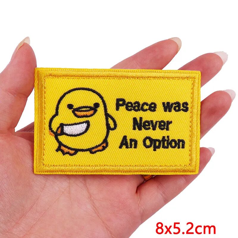 Желтая нашивка с уткой "Peace was Never an Option" 8x5.2 см