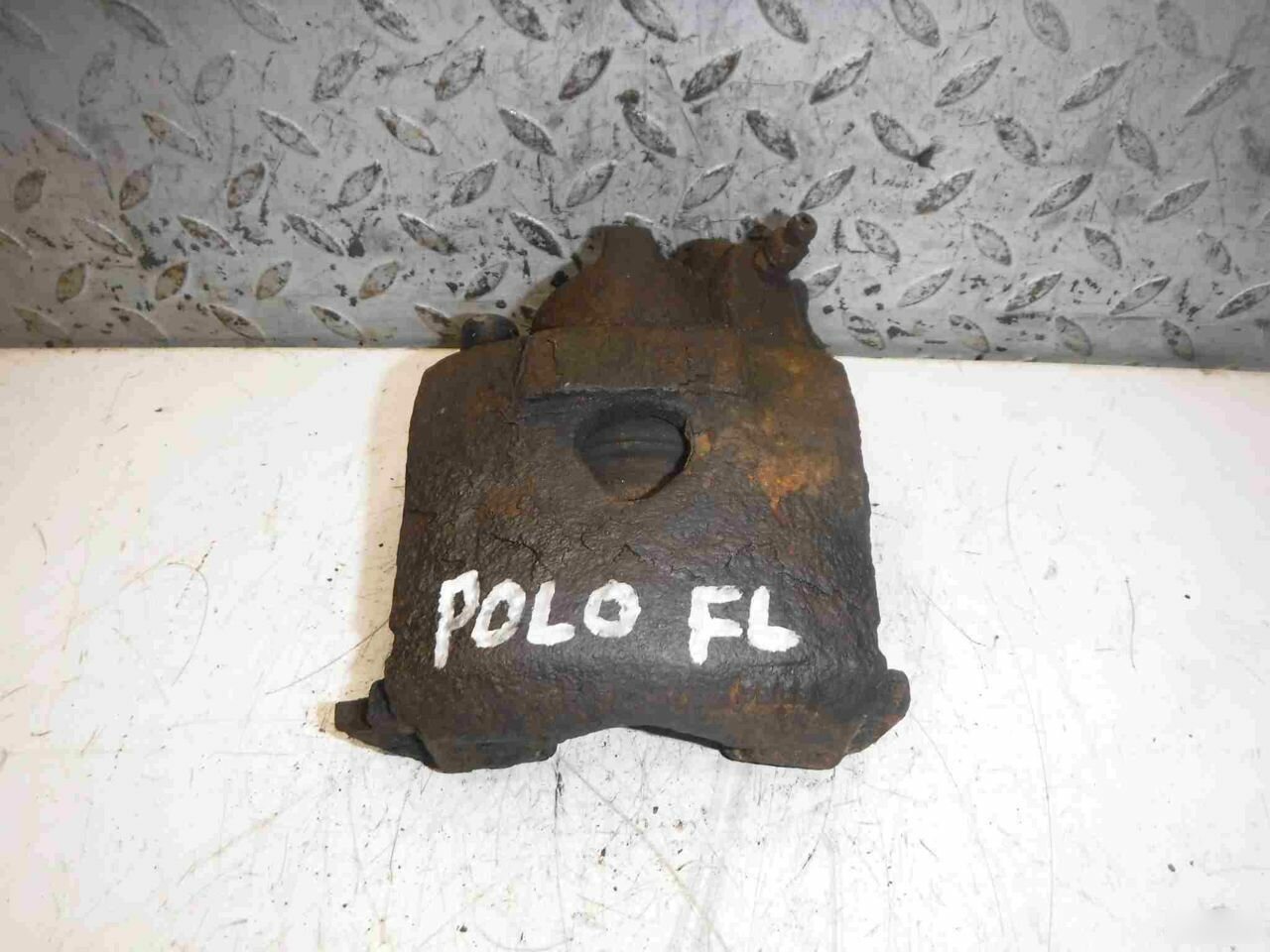 Суппорт тормозной передний левый Volkswagen Polo III (1994—2002) 6N0615123A