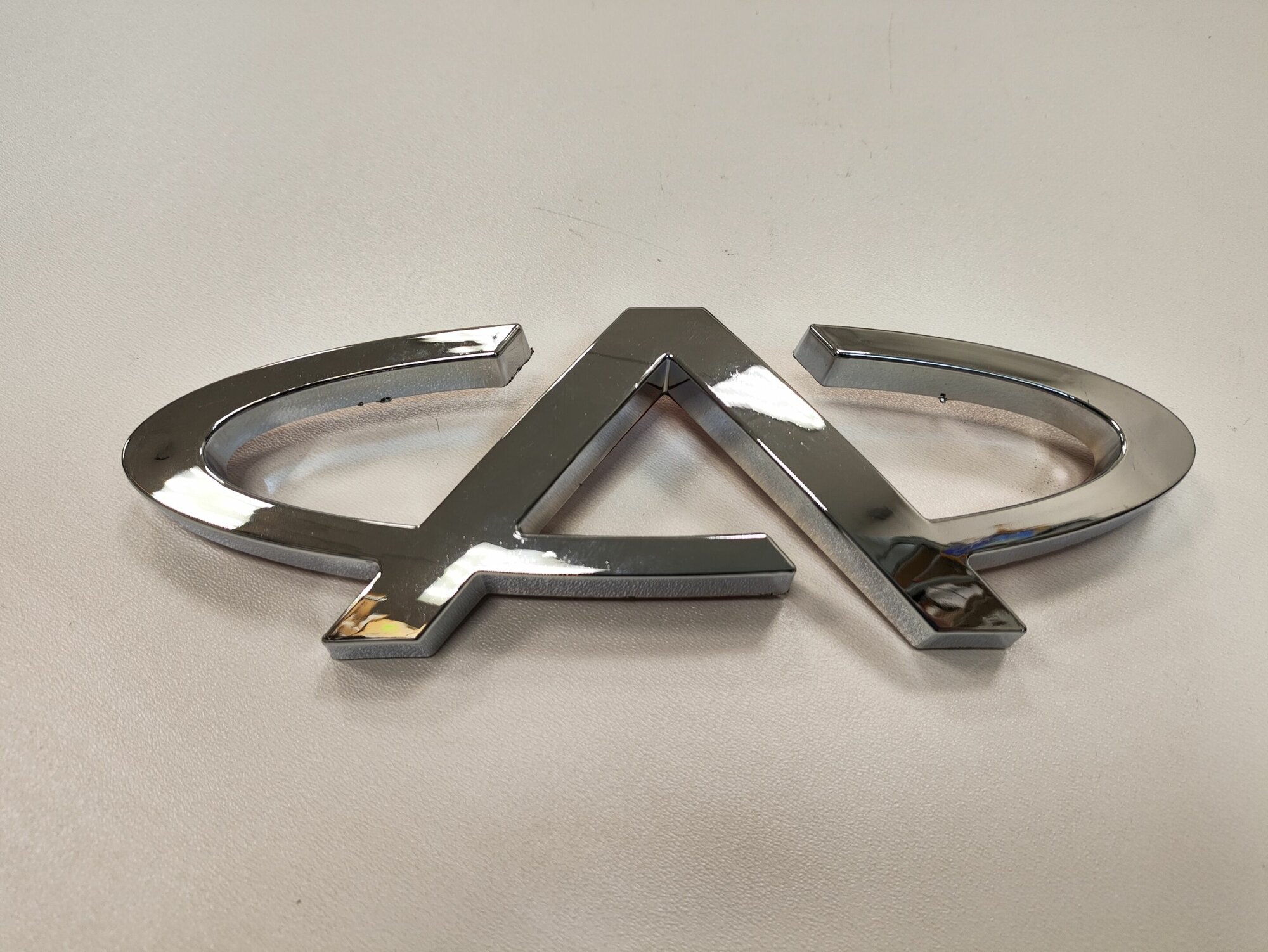 Эмблема на решетку радиатора Chery Tiggo [2.4 16V 4AT внедорожник 4X2] T11BJ3921501BC