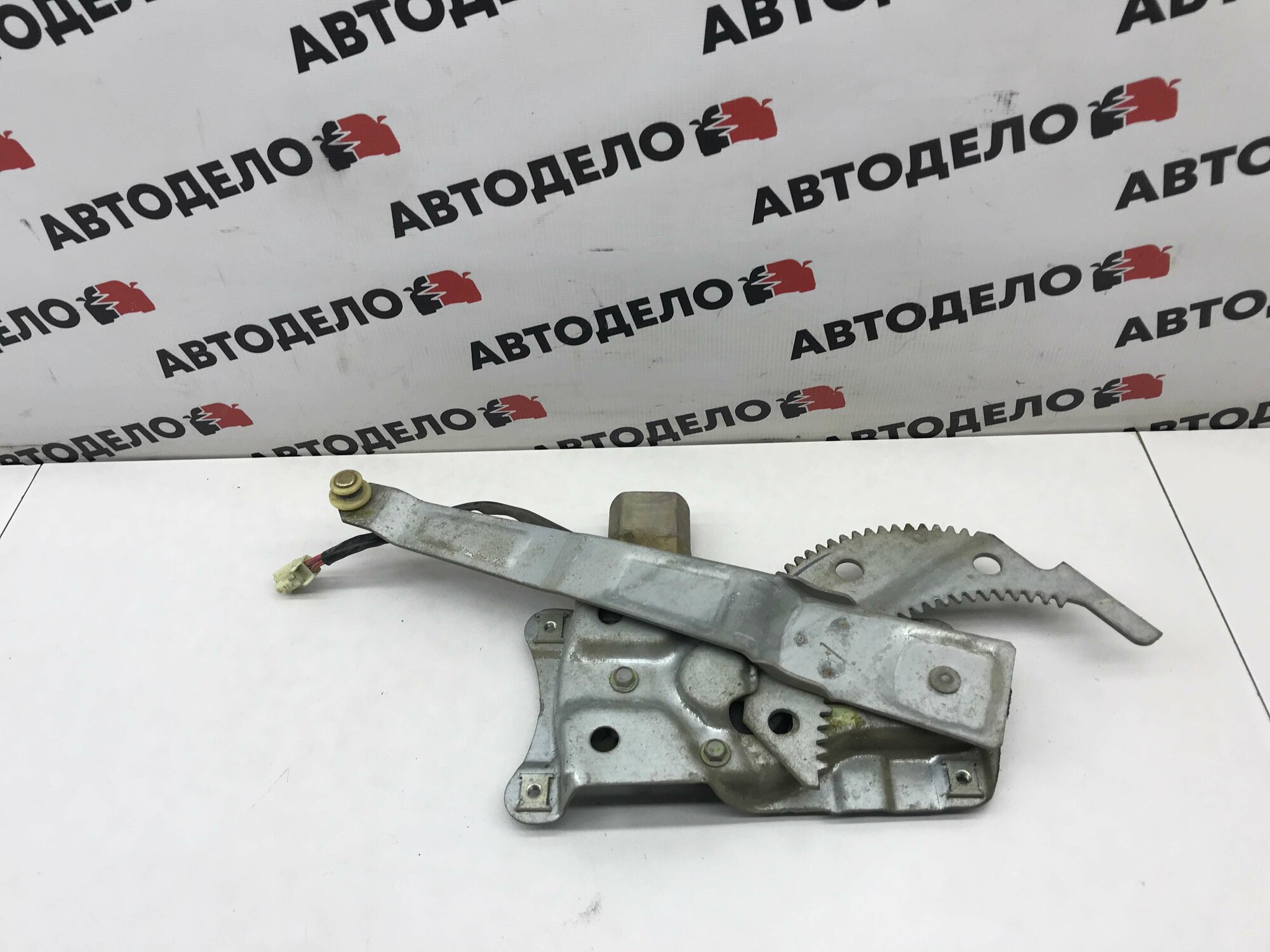 Стеклоподъемник з/л Mazda Familia GF-BJ5W 1998 г.в