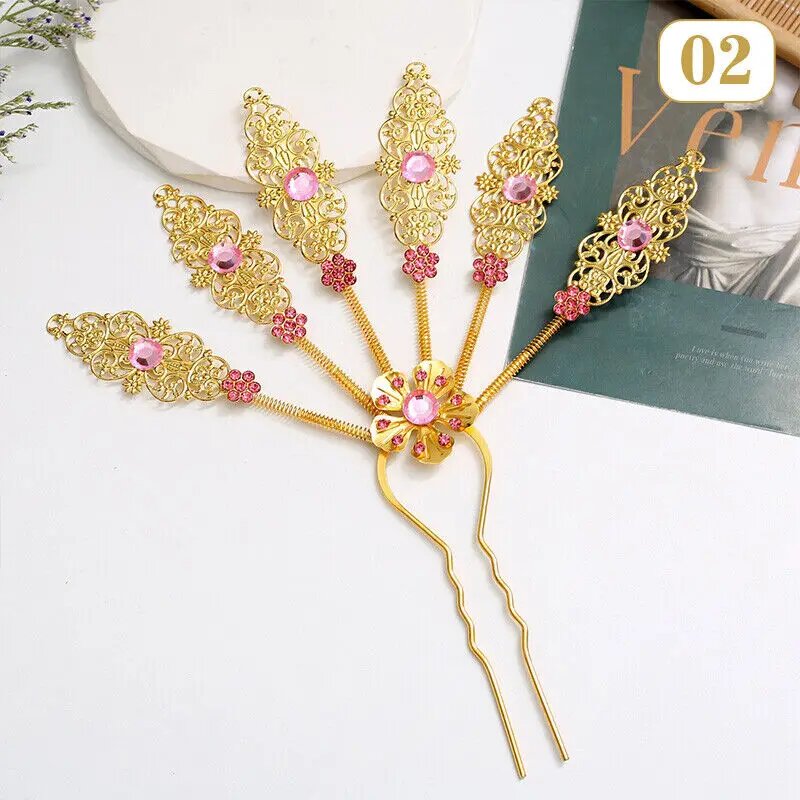 Золотой гребень для волос с розовыми акцентами