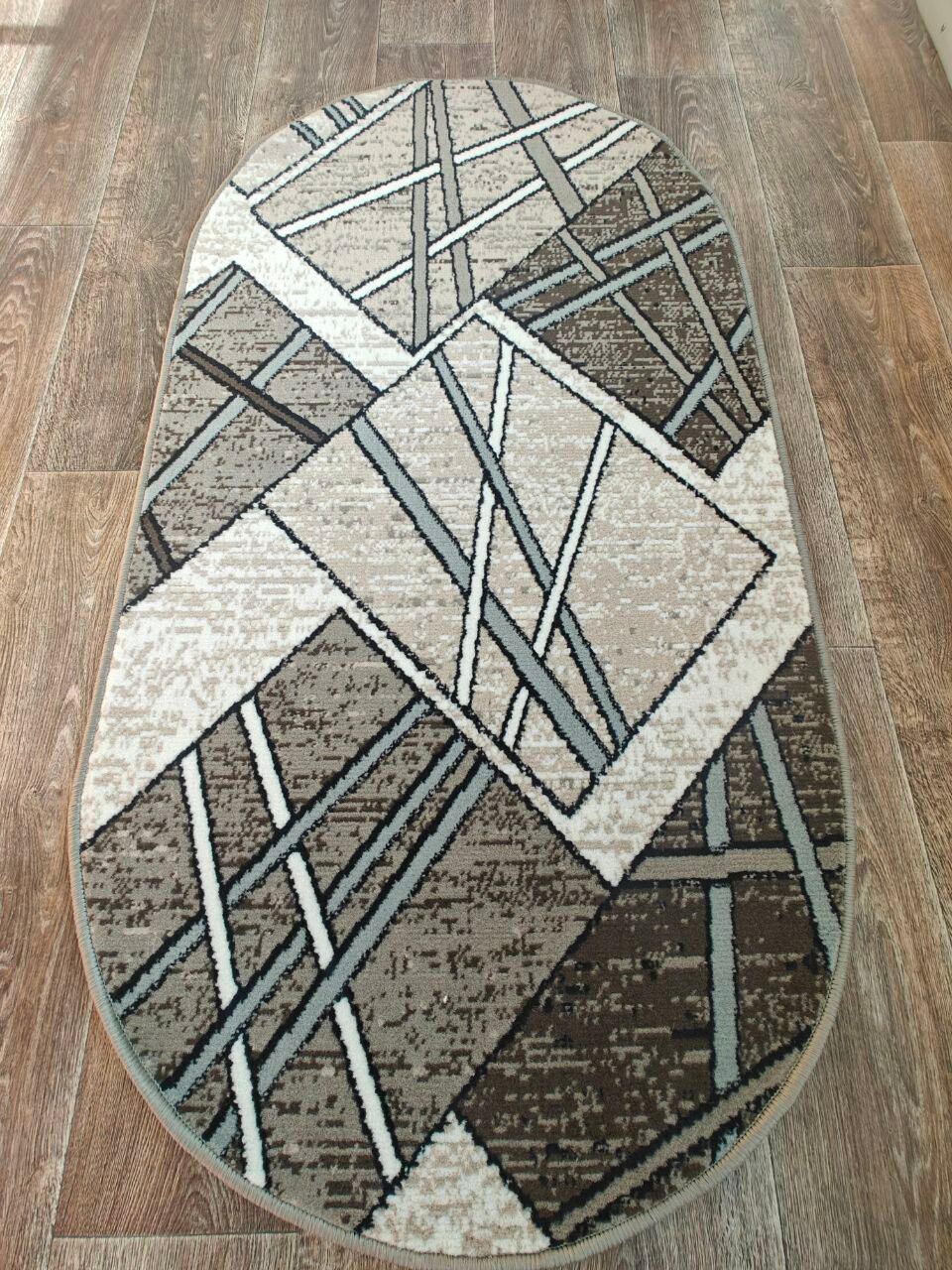 Коврик прикроватный серый на основу нанесен латекс и не скользит размер 80 на 150 овальной формы