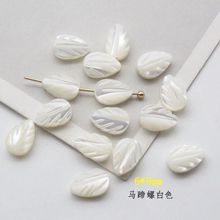 Бусины из раковин черных/белых цветов 6x9mm B