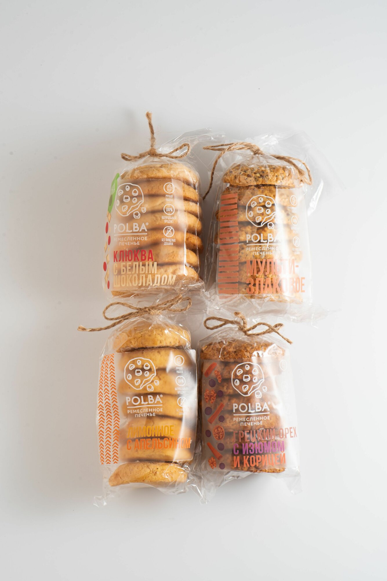 Печенье мульти злаковое, лимонное с апельсином, грецкий орех с изюмом и корицей; клюква и белым шоколад