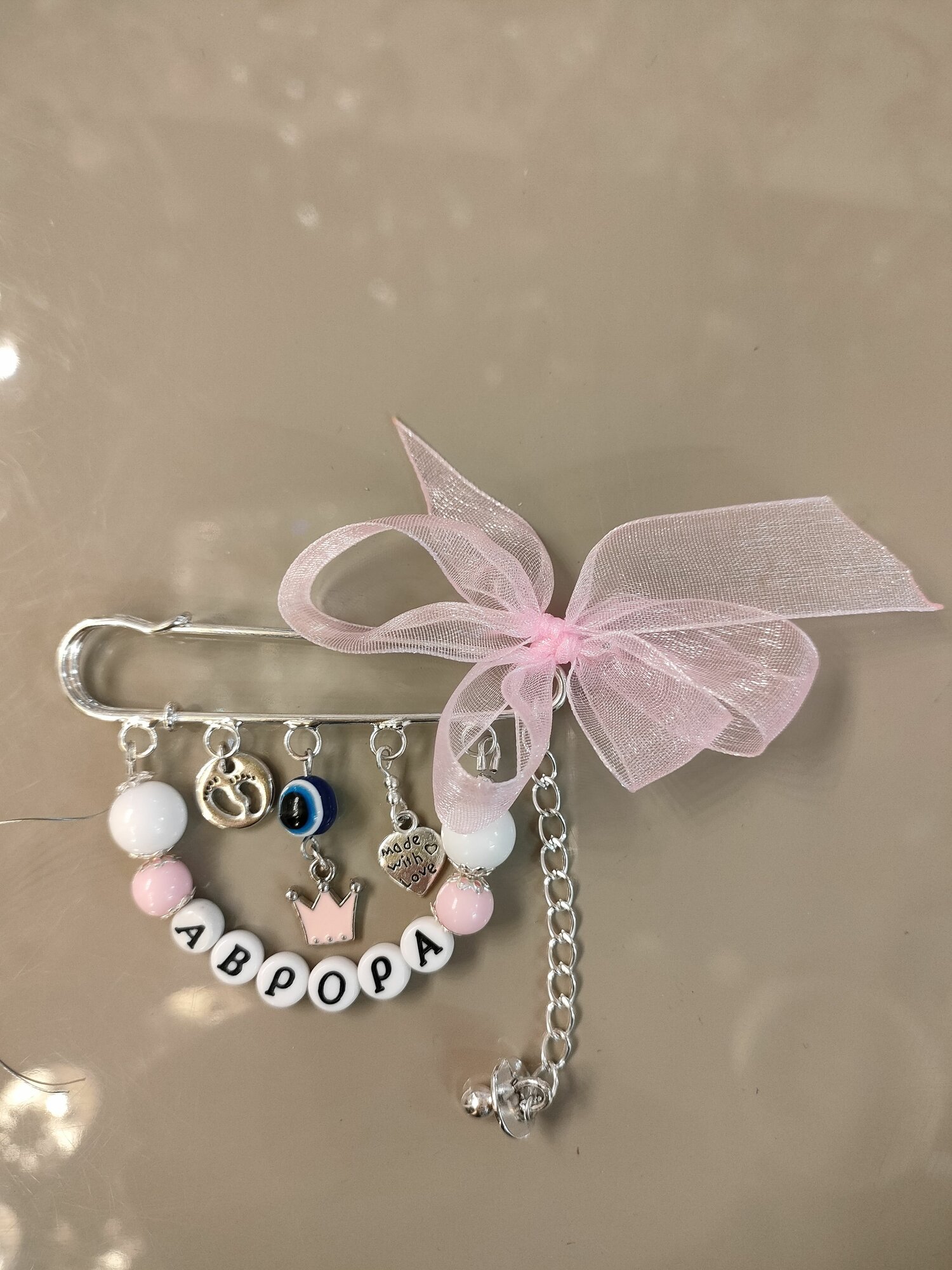 Булавка-оберег от сглаза для новорожденных на коляску