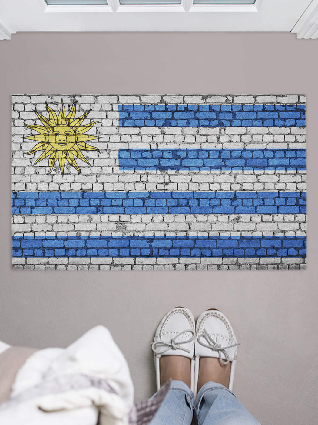 Коврик придверный в прихожую с принтом "Флаг Уругвая на кирпичной стене" 45x75 см , JoyArty