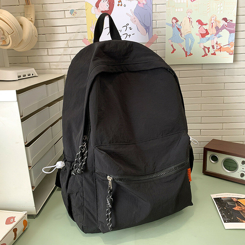 Unisex basic backpack with spacious interior and durable material for school and leisure activities