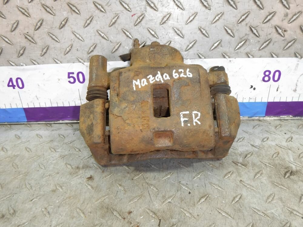 Суппорт передний правый Mazda 626 GF