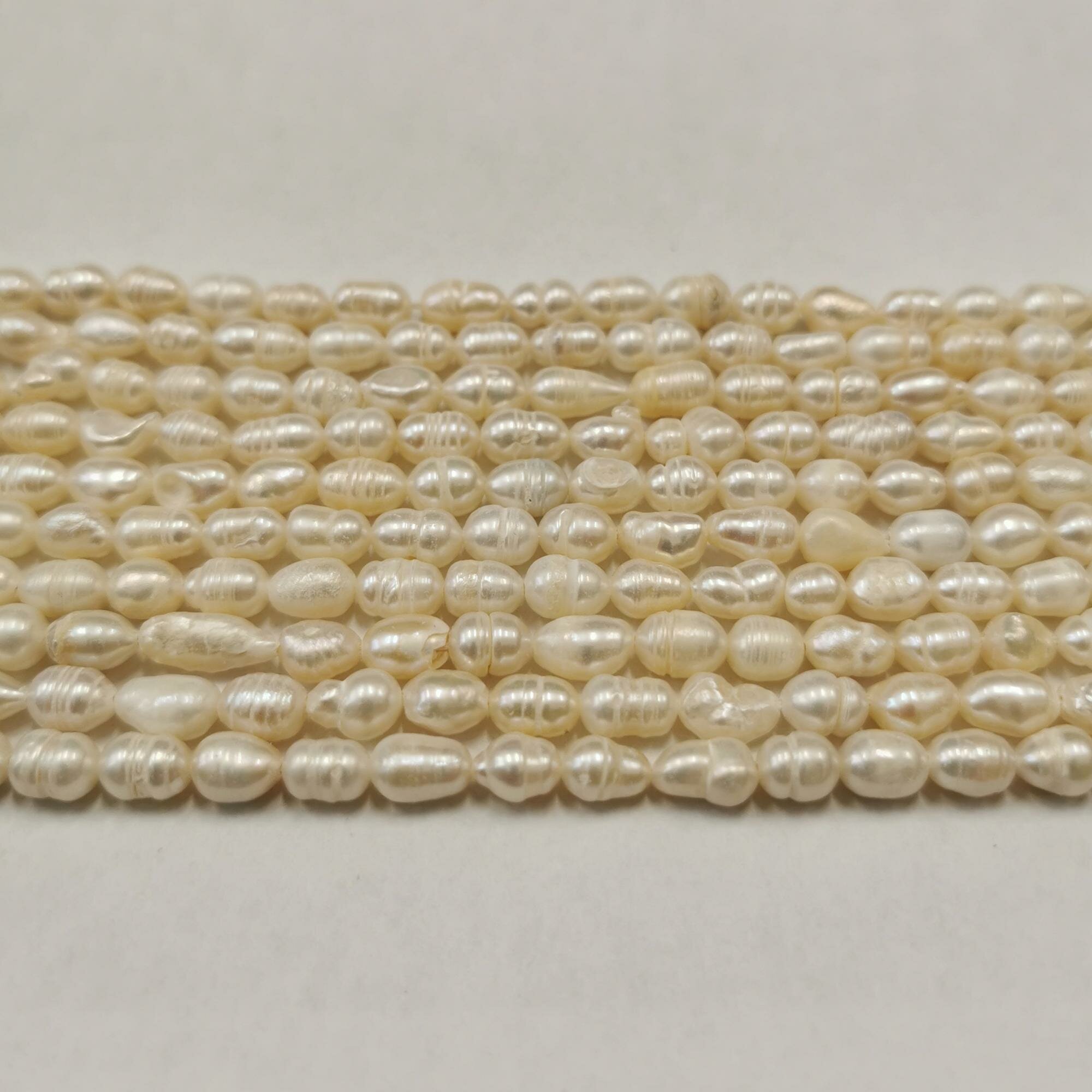 Бусина из жемчуга 7х5-10х7мм, качество В, барокко, рис, белый, 35-45 шт, низка