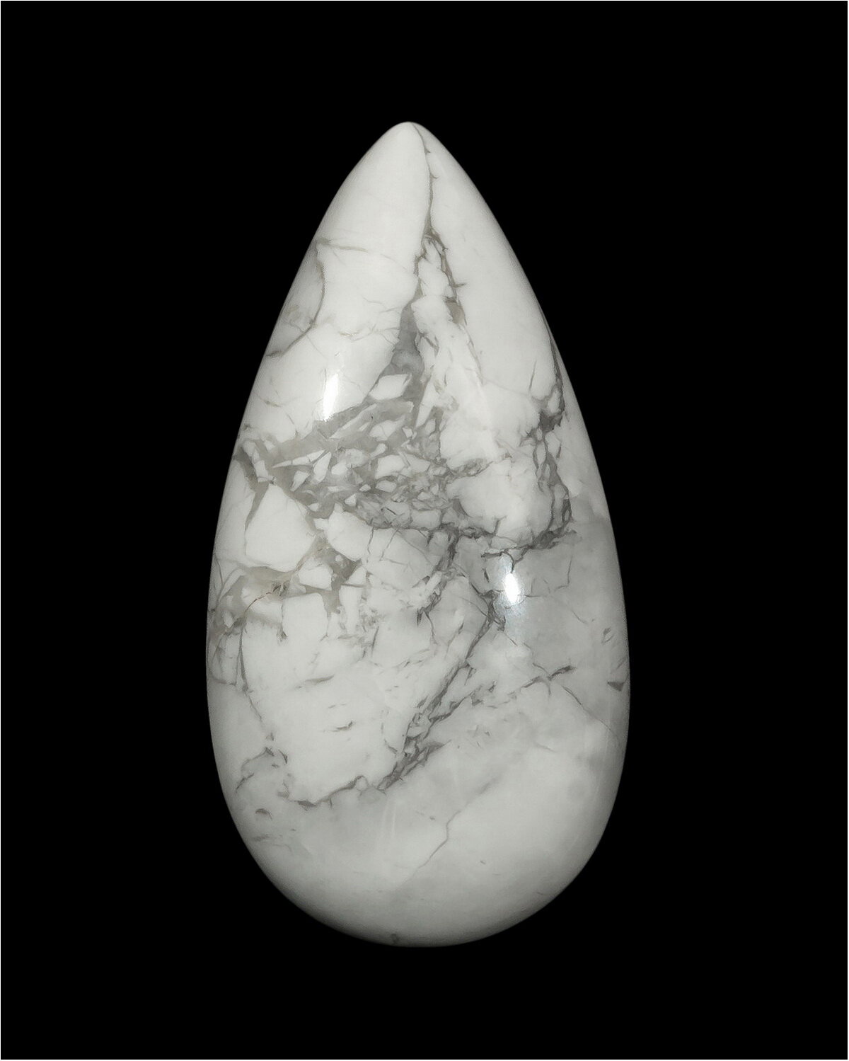 Магнезит, кабошон из минерала, размер: 47х24х7 мм, натуральный камень.